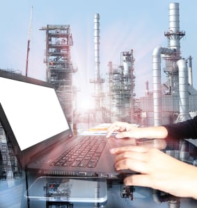 hand working on laptop computer with oil refinery industry - Chemical ...